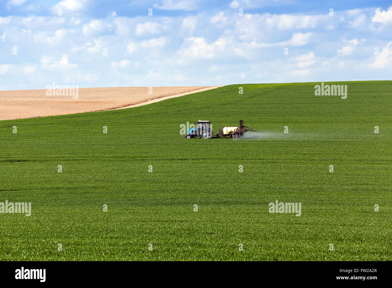 tractor in the field Stock Photo - Alamy