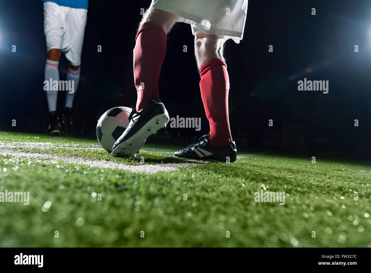 Two soccer players kicking a soccer ball Stock Photo - Alamy