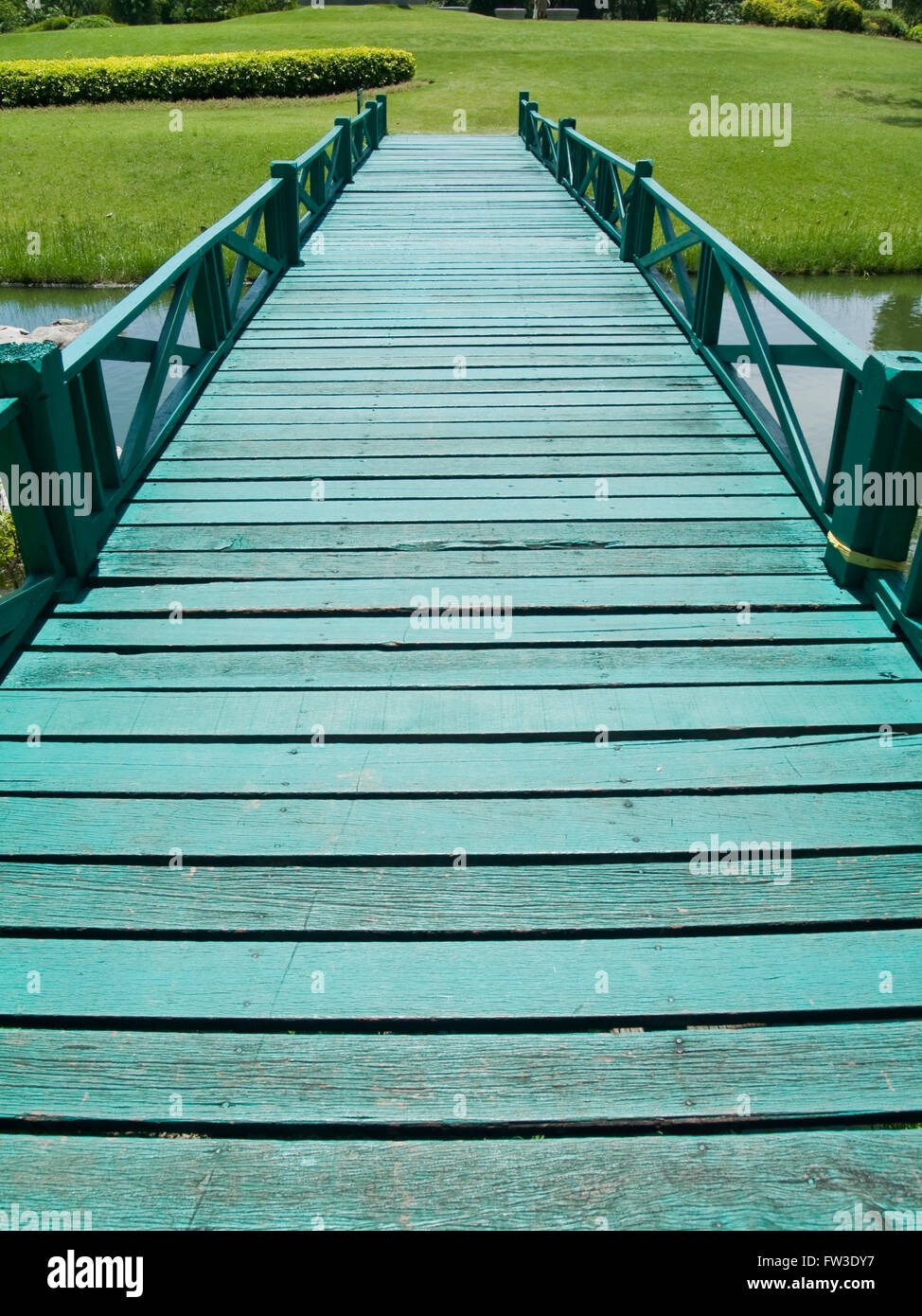 Green wooden bridge Stock Photo - Alamy