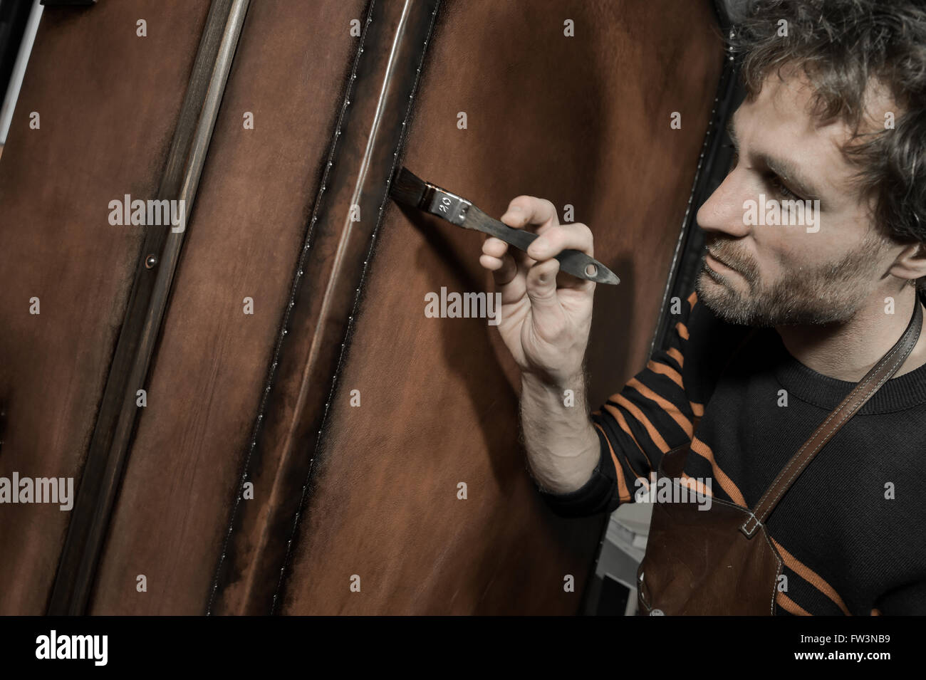 Trunk Maker at work in his luxury leather workshop, France Stock Photo ...