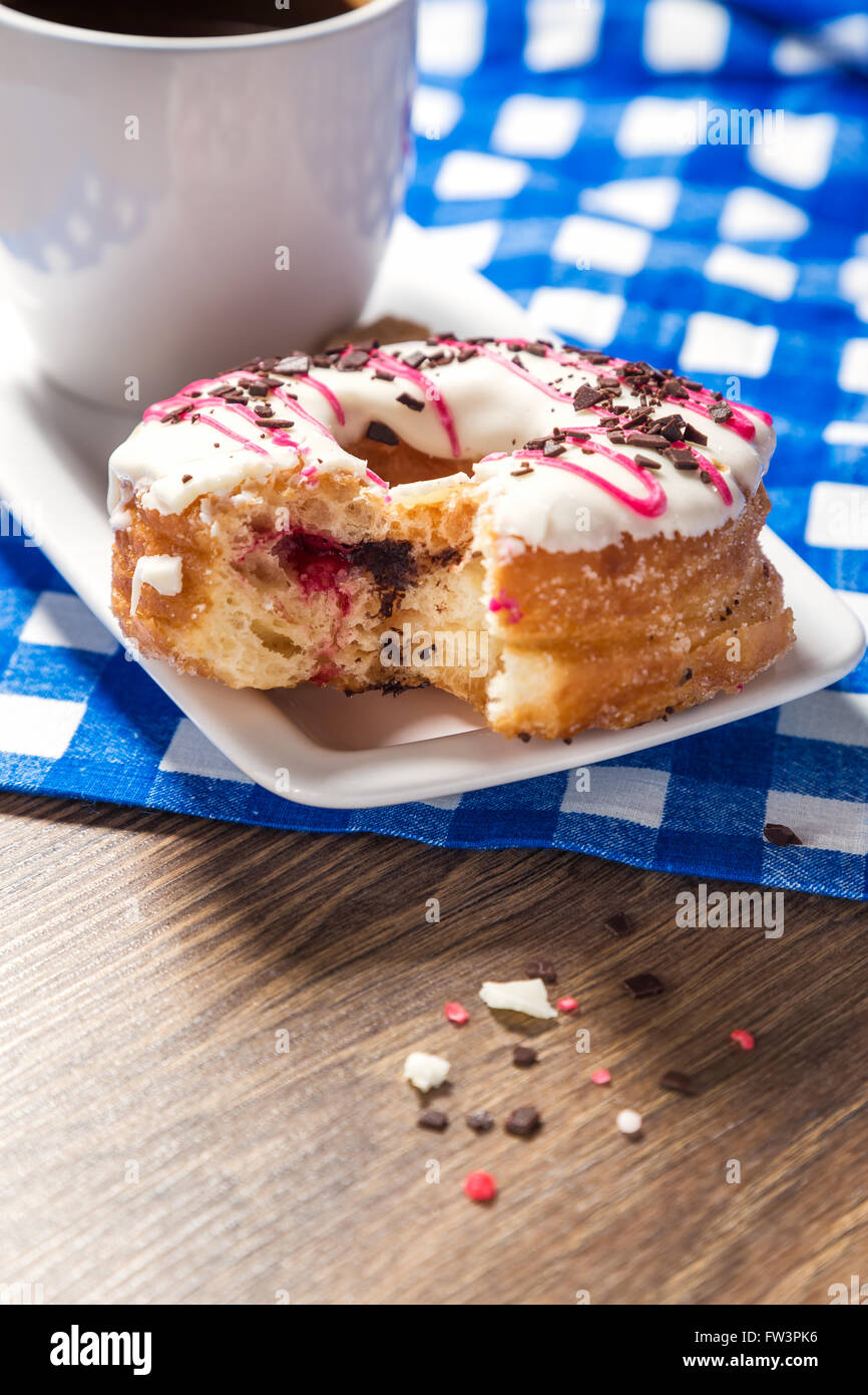 Breakfast with glazed donut and coffee cup Stock Photo - Alamy