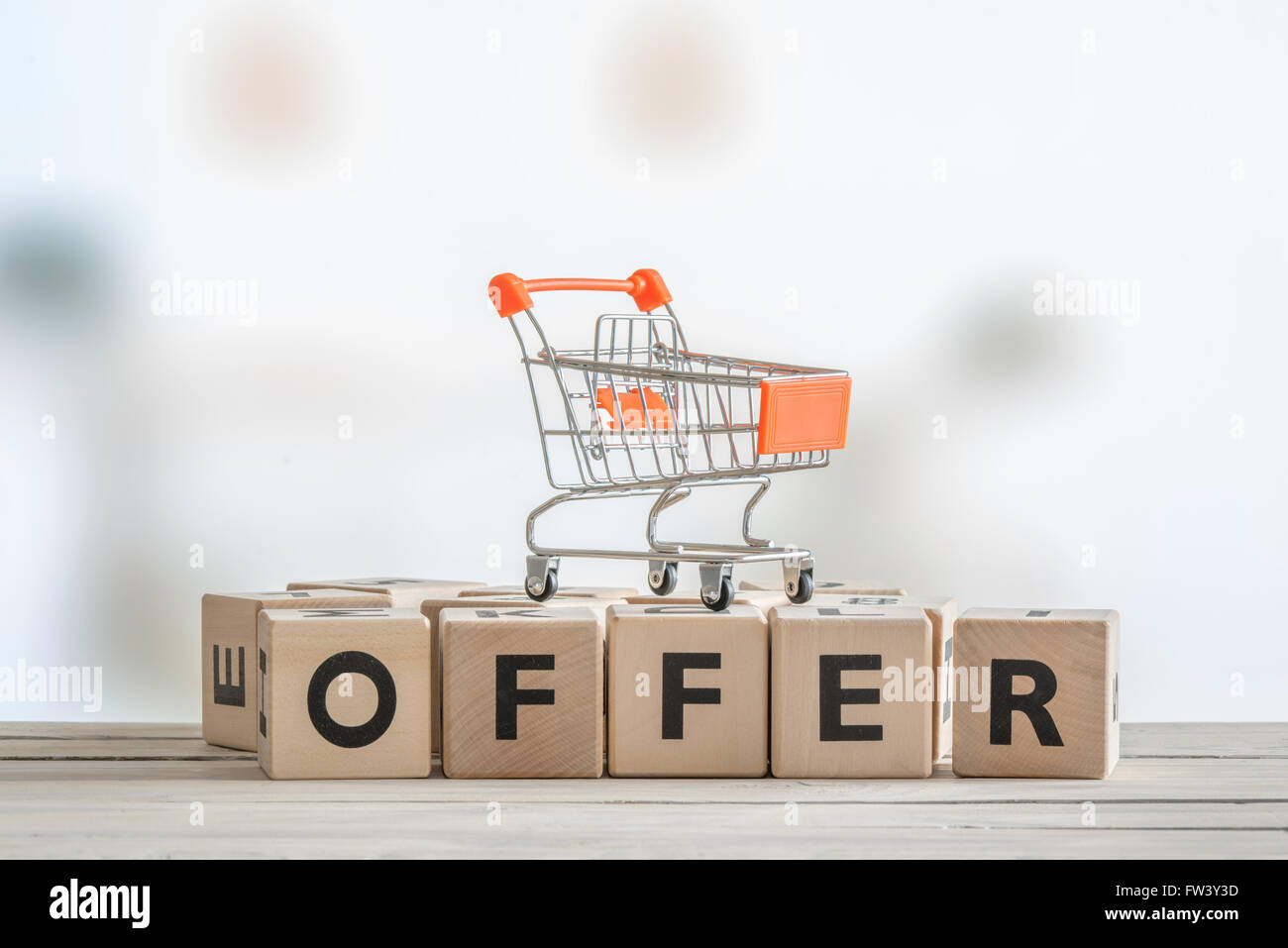 Special offer with an orange shopping cart Stock Photo - Alamy