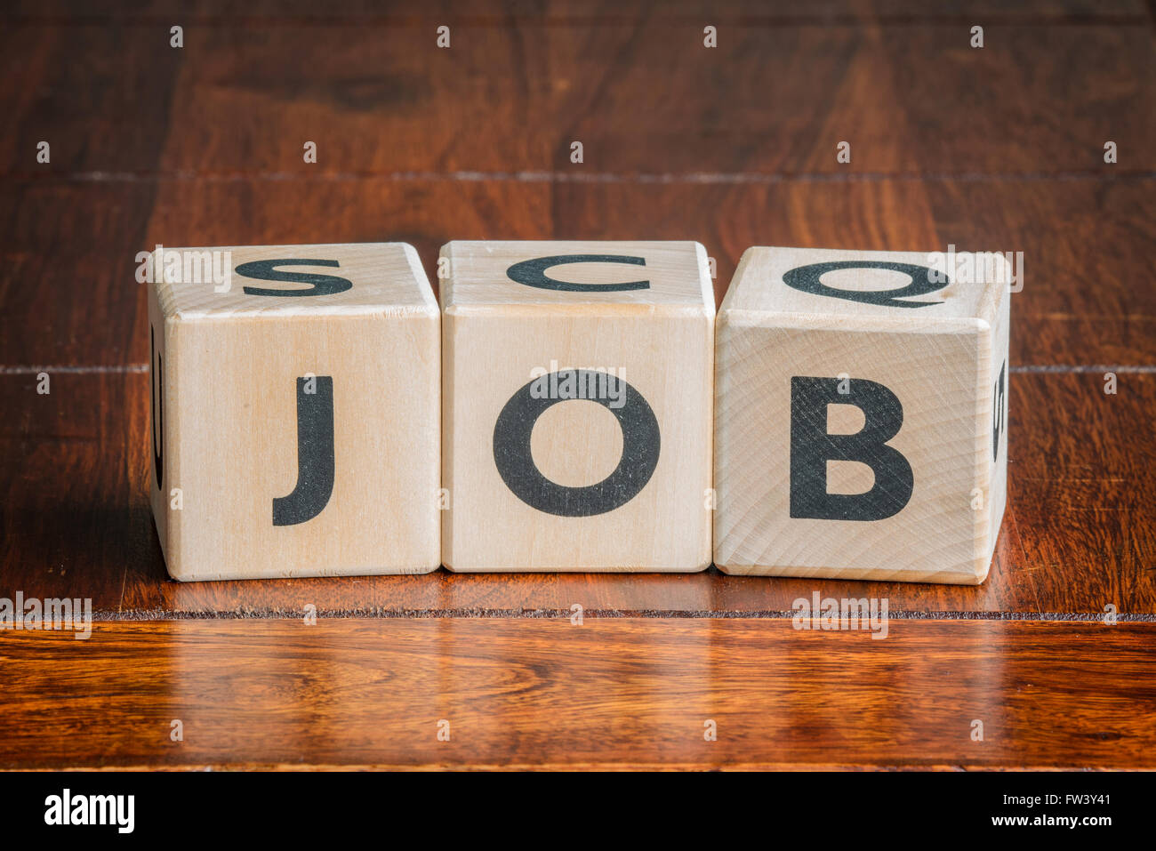 Cubes with the word job on a dark wooden table Stock Photo - Alamy