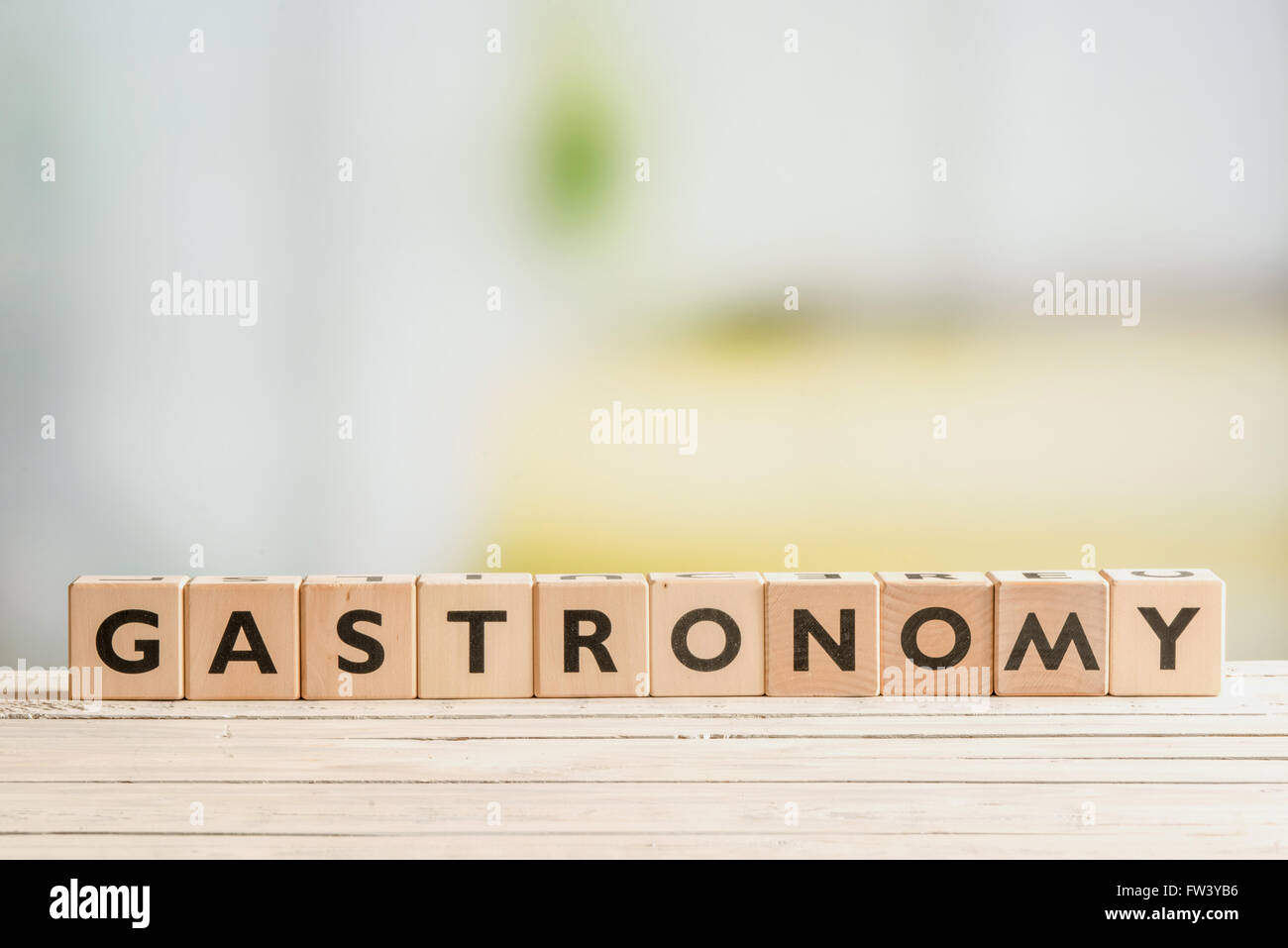 Gastronomy sign on a table made of wood Stock Photo - Alamy