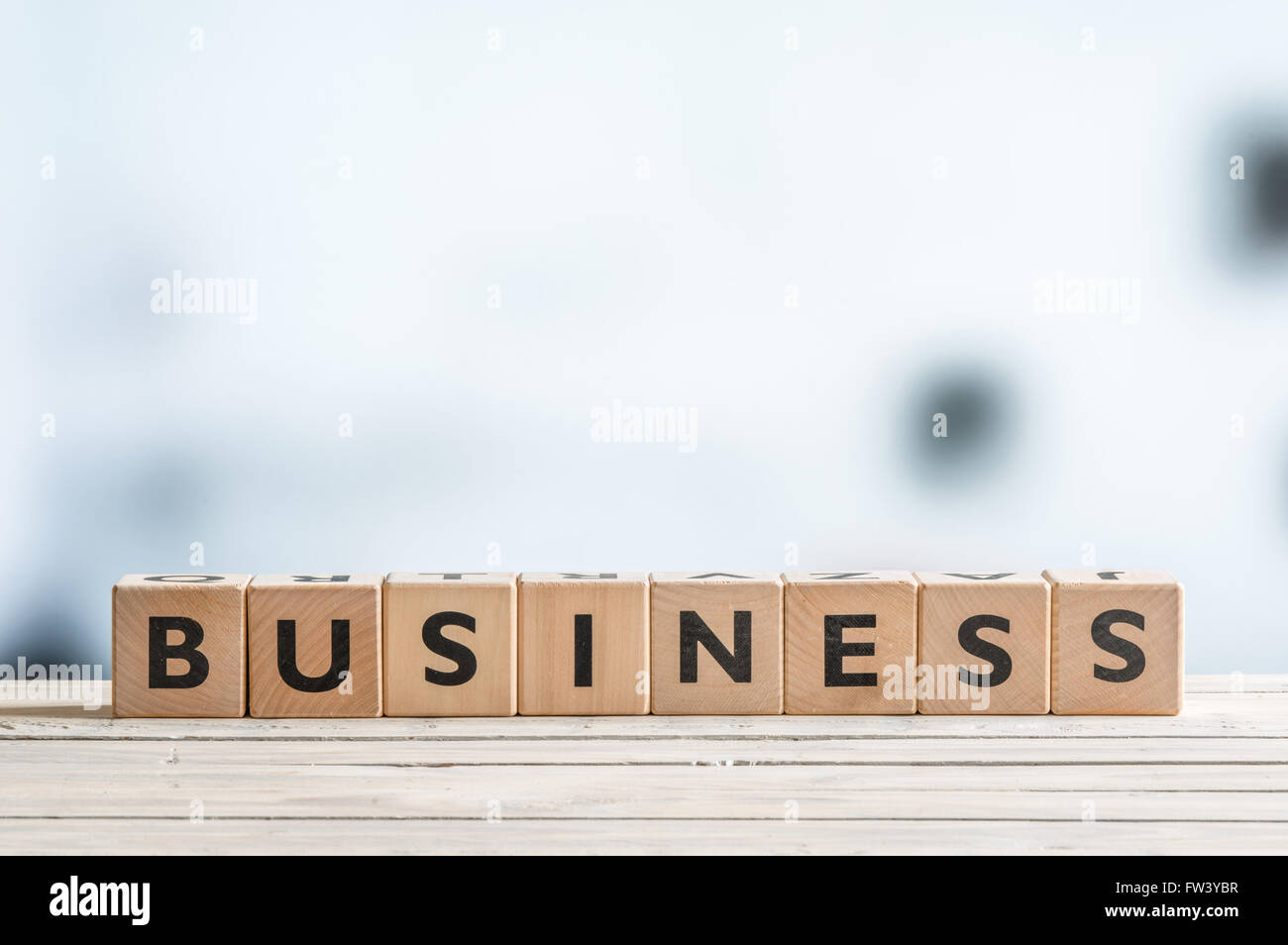 Business word on a wooden sign made of blocks Stock Photo - Alamy