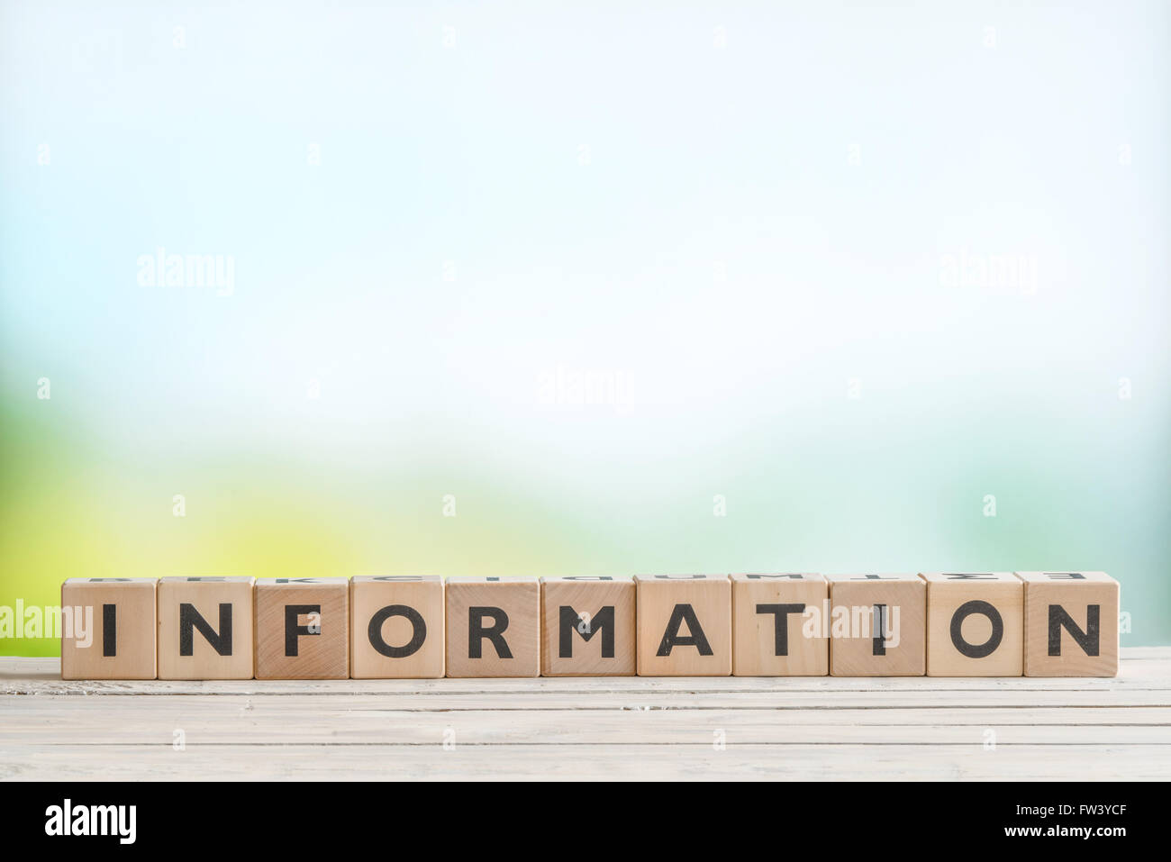 Information sign on an outdoor wooden table Stock Photo - Alamy