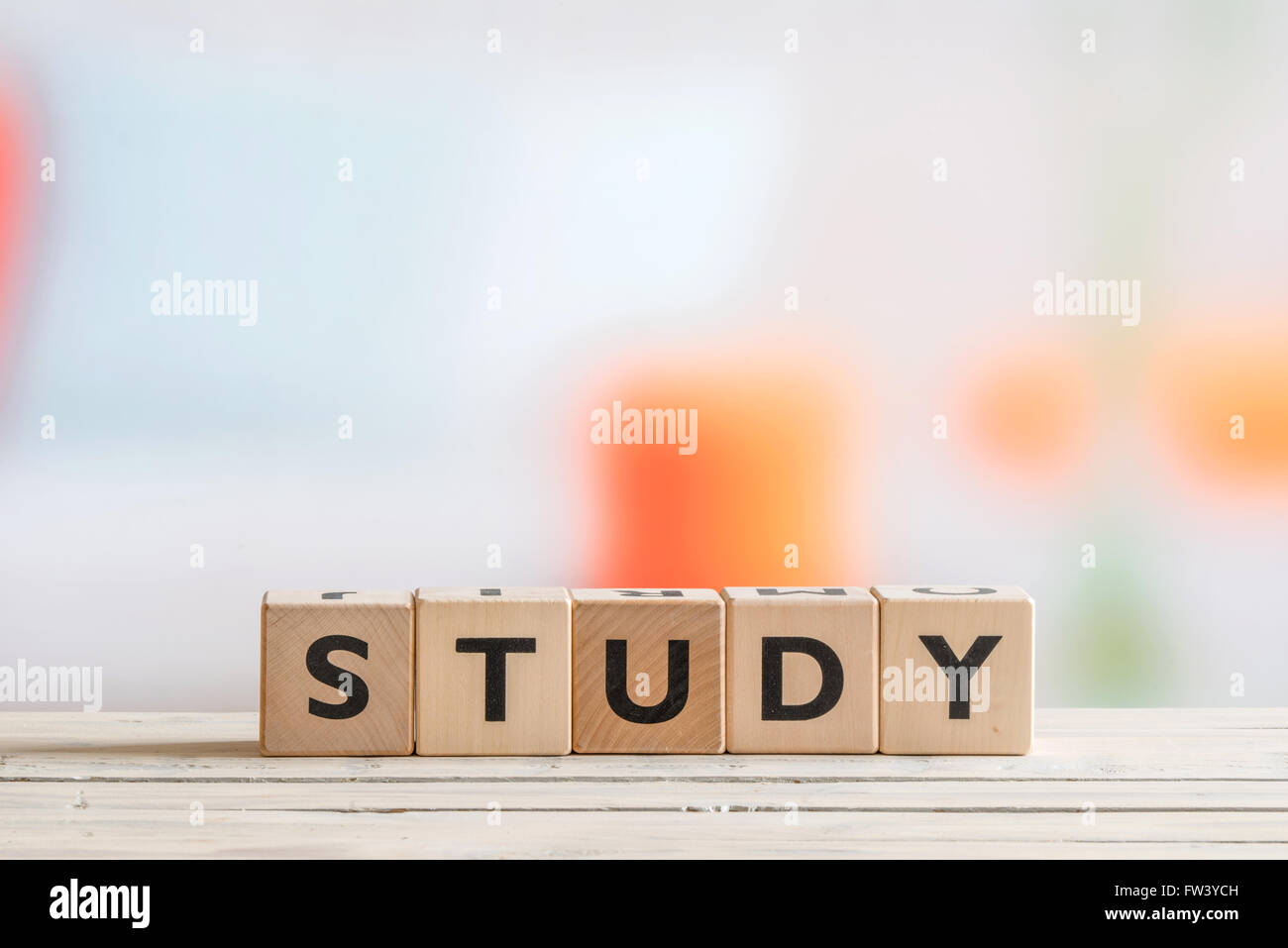 Study sign made of cubes on a wooden table Stock Photo - Alamy