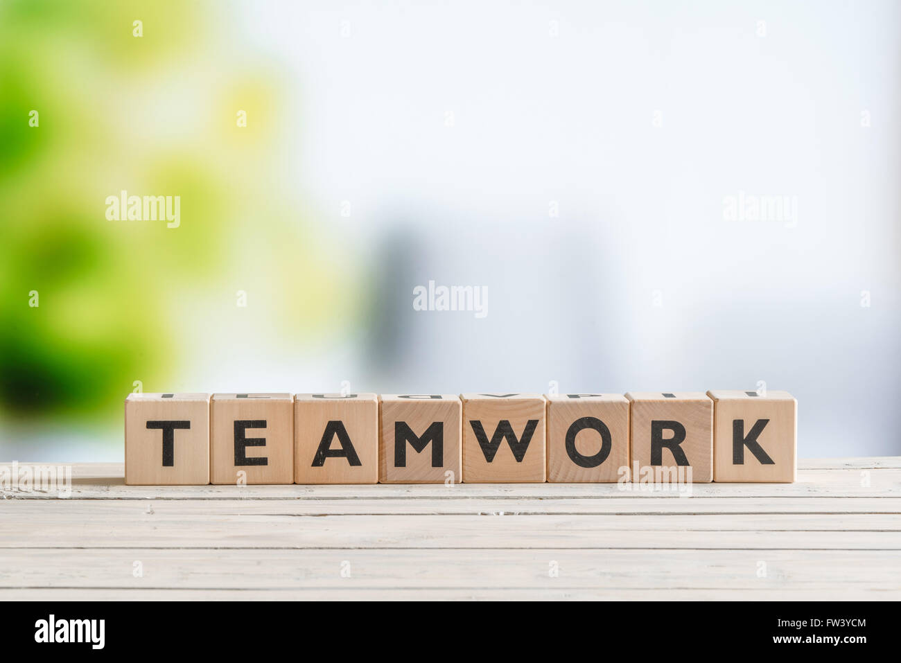 Teamwork message made of cubes on a table Stock Photo - Alamy
