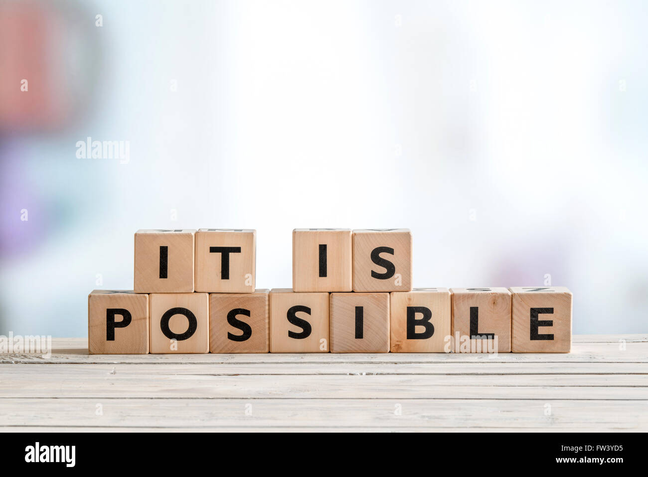 It is possible sign made of wooden cubes on a table Stock Photo - Alamy