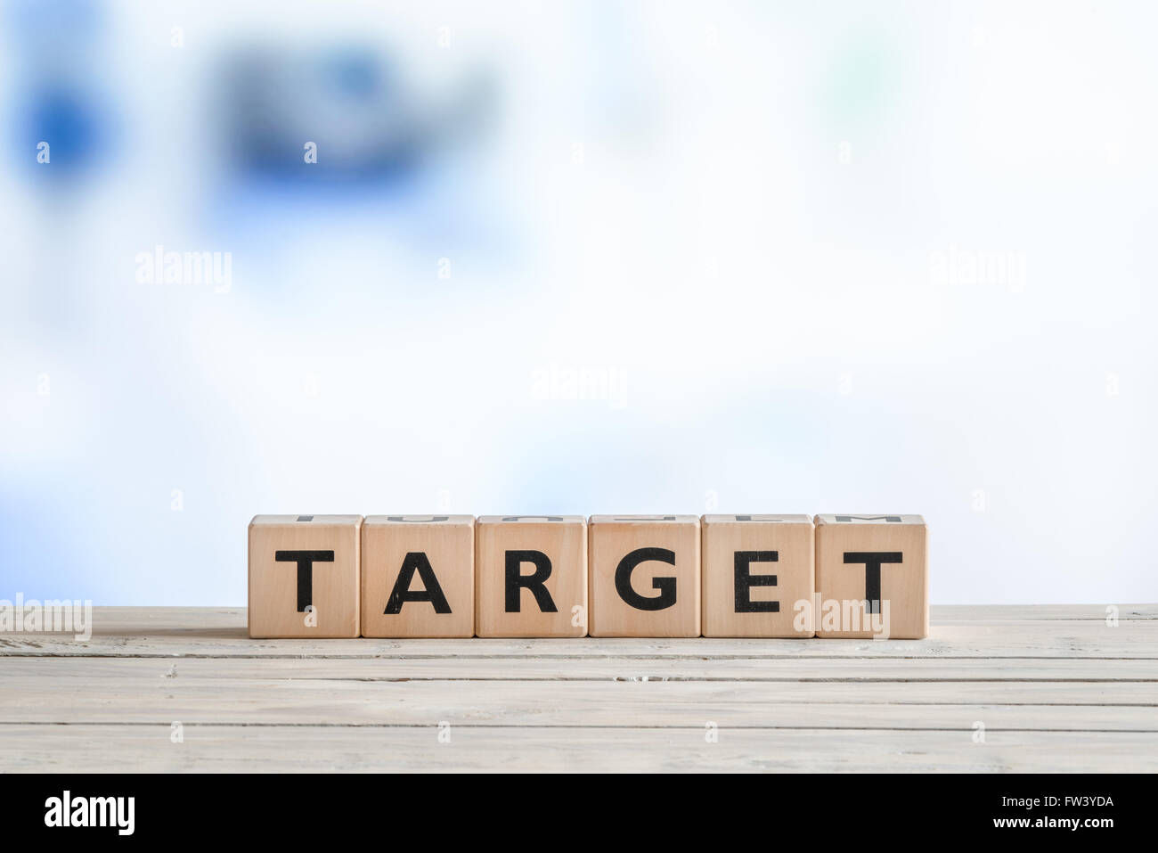 Target sign with wooden cubes on a table Stock Photo - Alamy