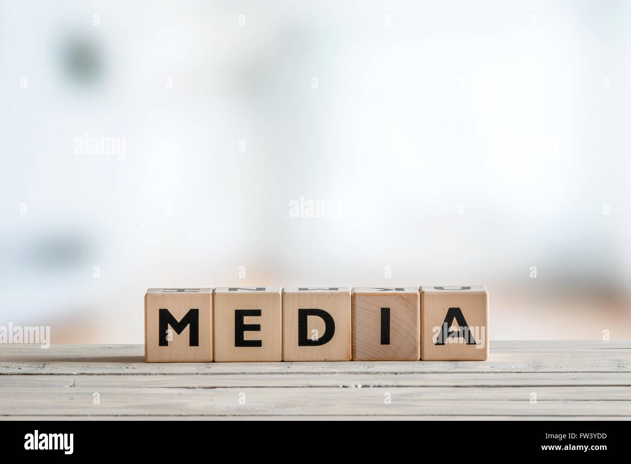 Media sign made of blocks on a wooden table Stock Photo - Alamy