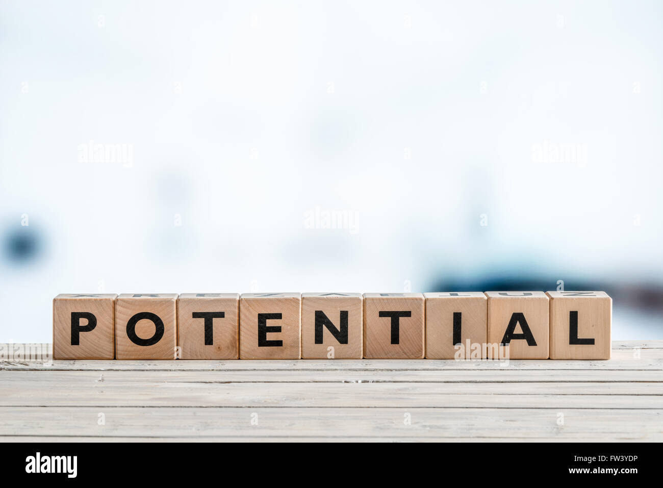 Potential word made of wooden cubes on a table Stock Photo - Alamy