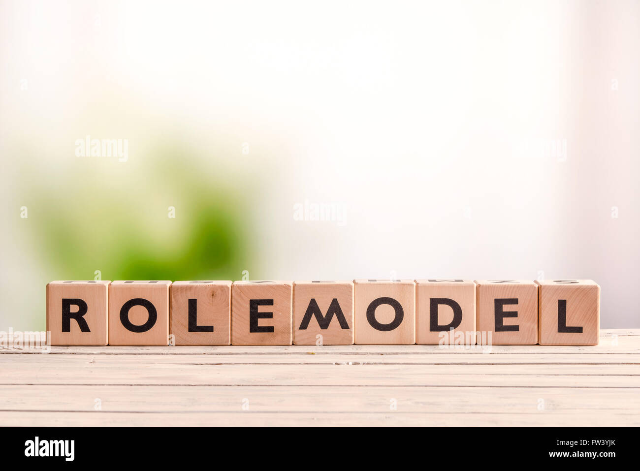 Rolemodel sign made with cubes on a table Stock Photo - Alamy