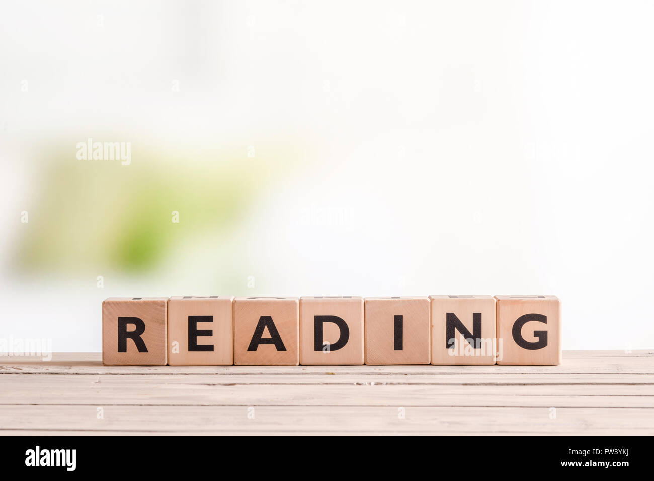 Reading sign made of wood on a table Stock Photo - Alamy
