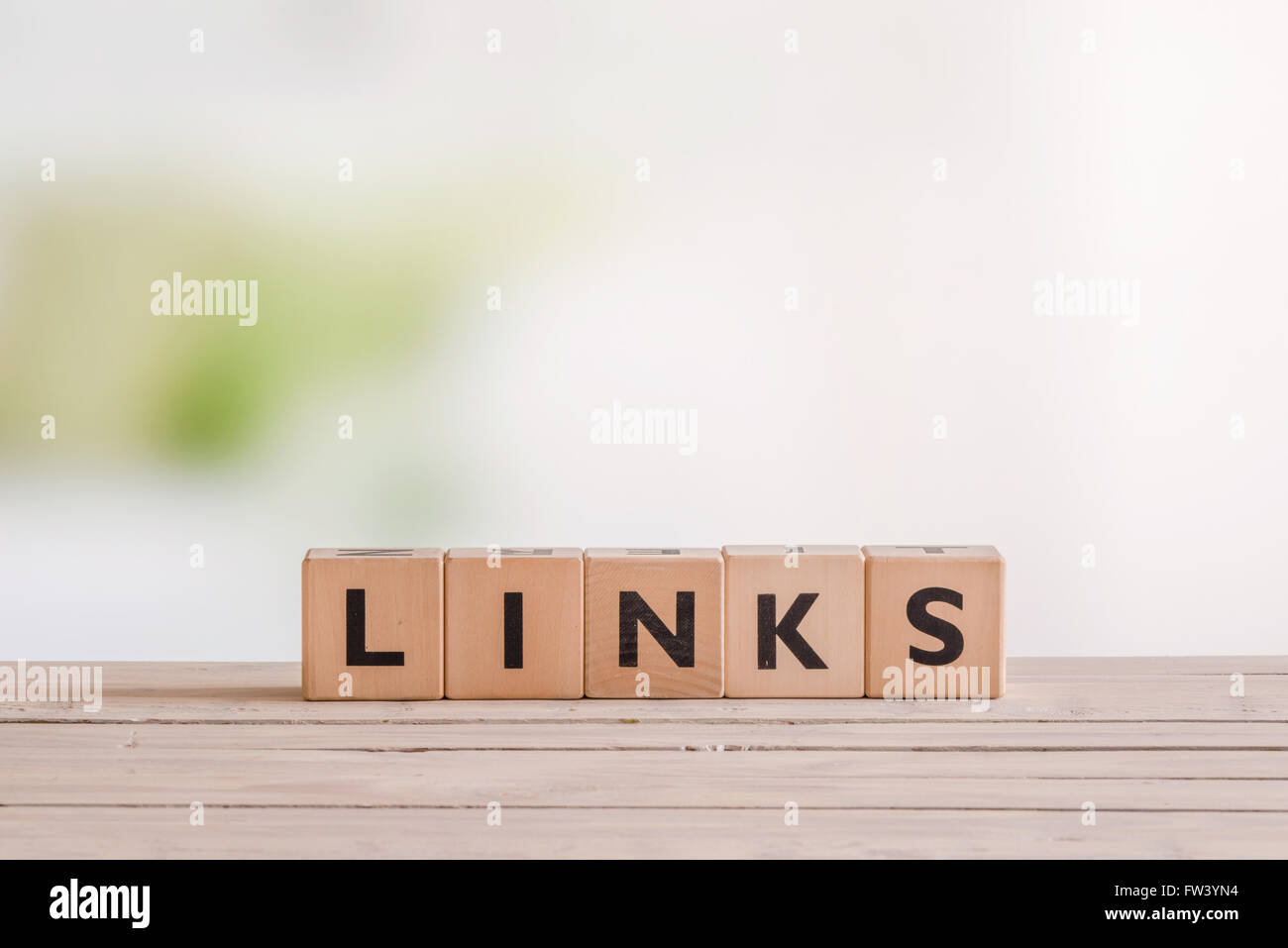 Links sign standing on a wooden desk Stock Photo - Alamy