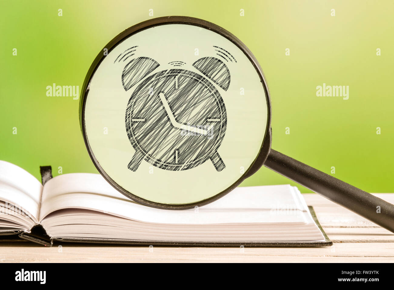 Alarm clock search with a pencil drawing of time in a magnifying glass ...