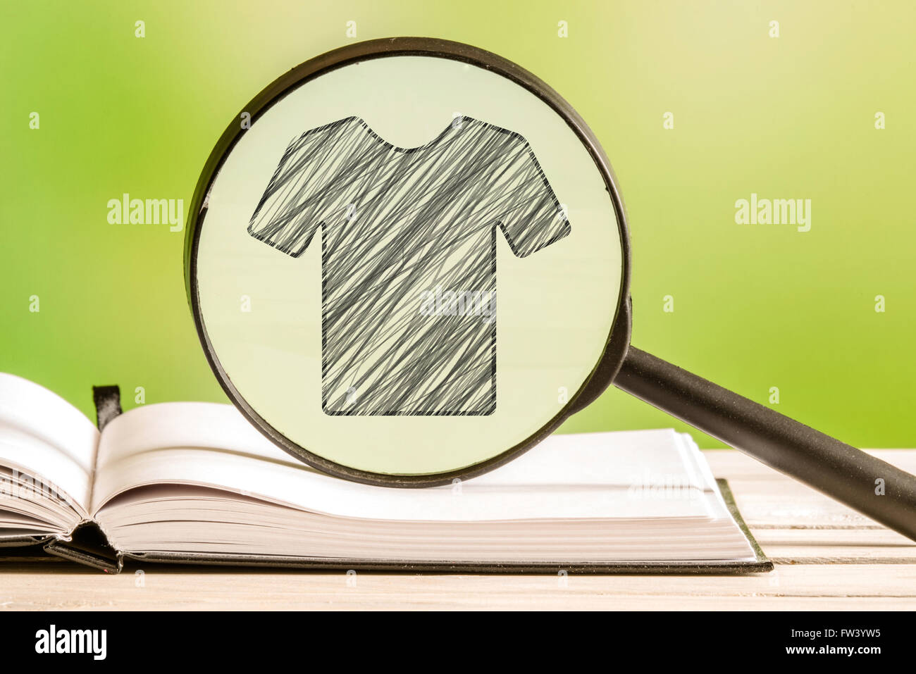 Clothes search with a pencil drawing of a shirt in a magnifying glass ...
