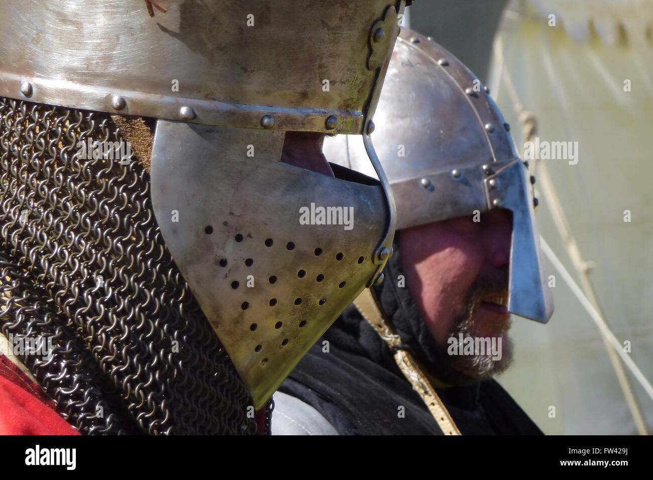 Two medieval re-enactors wearing helmets and chain mail Stock Photo - Alamy