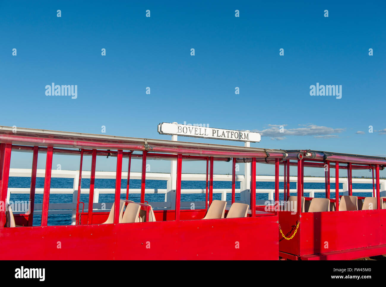 The small red train travels along the longest jetty of the Southern ...