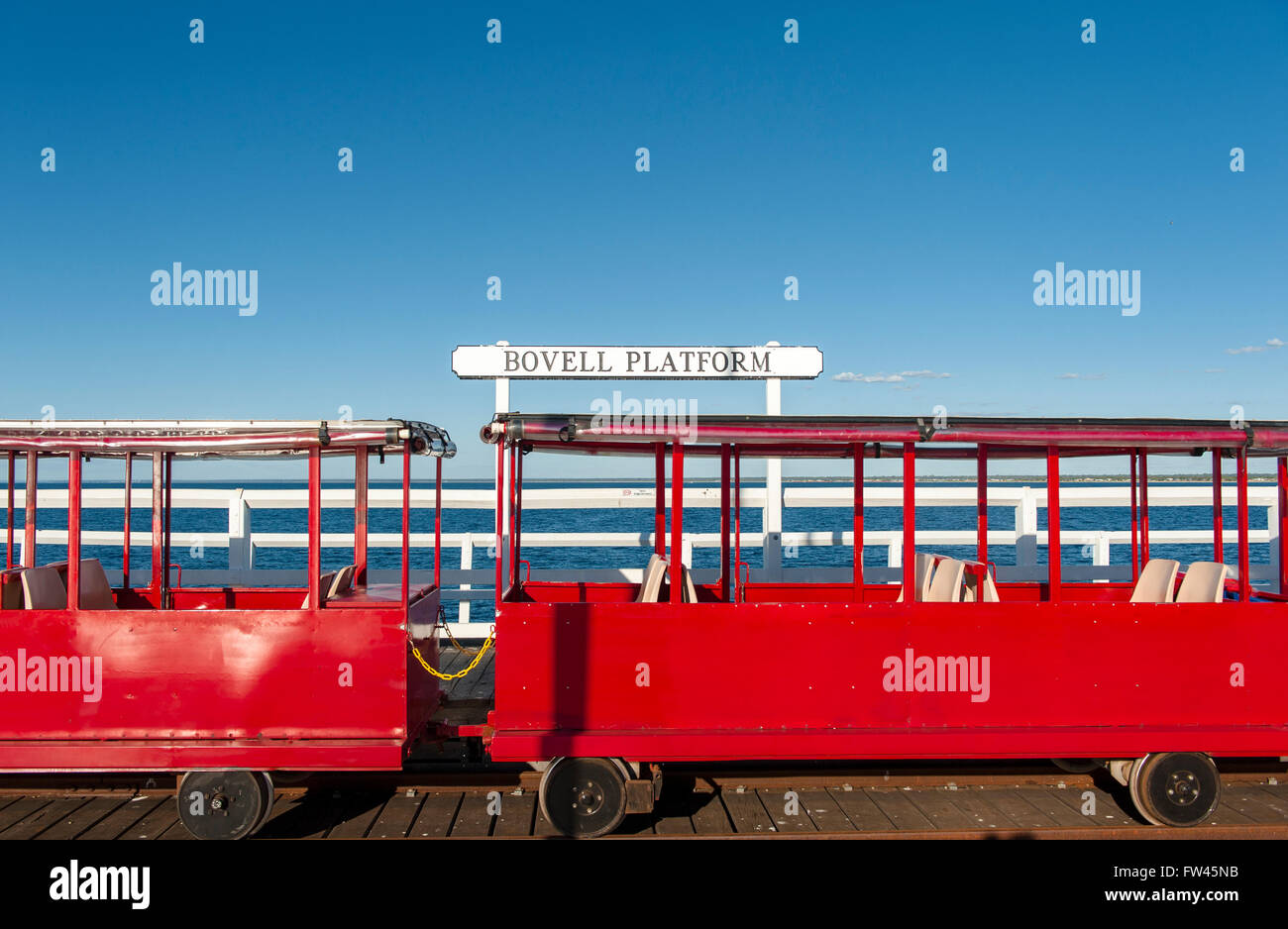 The small red train travels along the longest jetty of the Southern ...