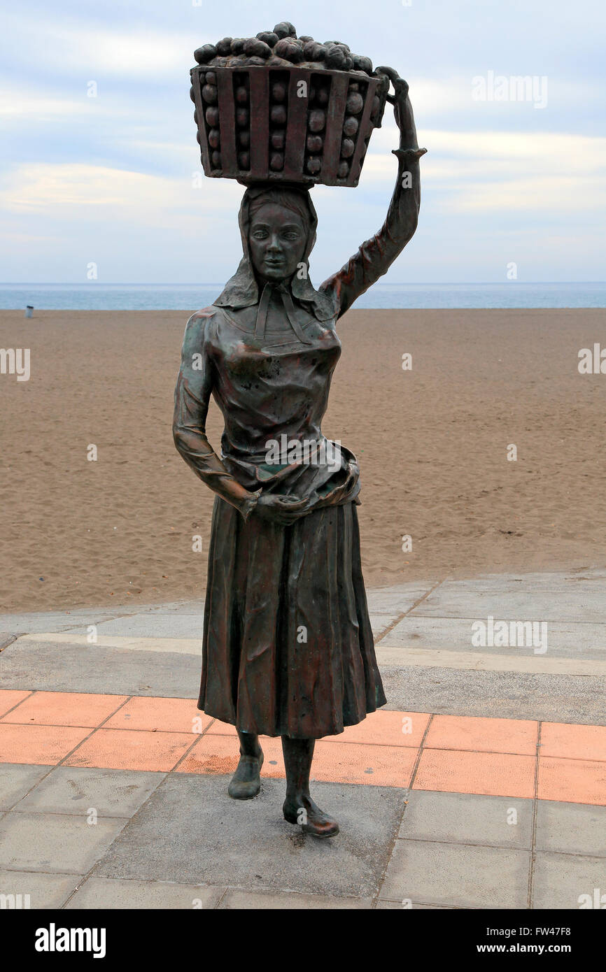 Statue of woman carrying basket hi-res stock photography and images - Alamy