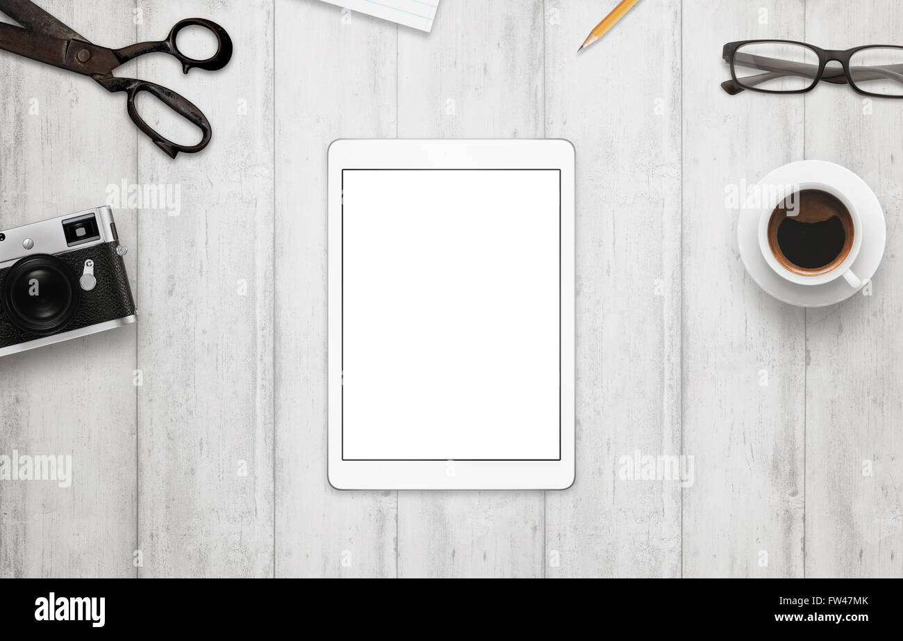 Tablet with isolated white screen for mockup. Work desk with camera ...