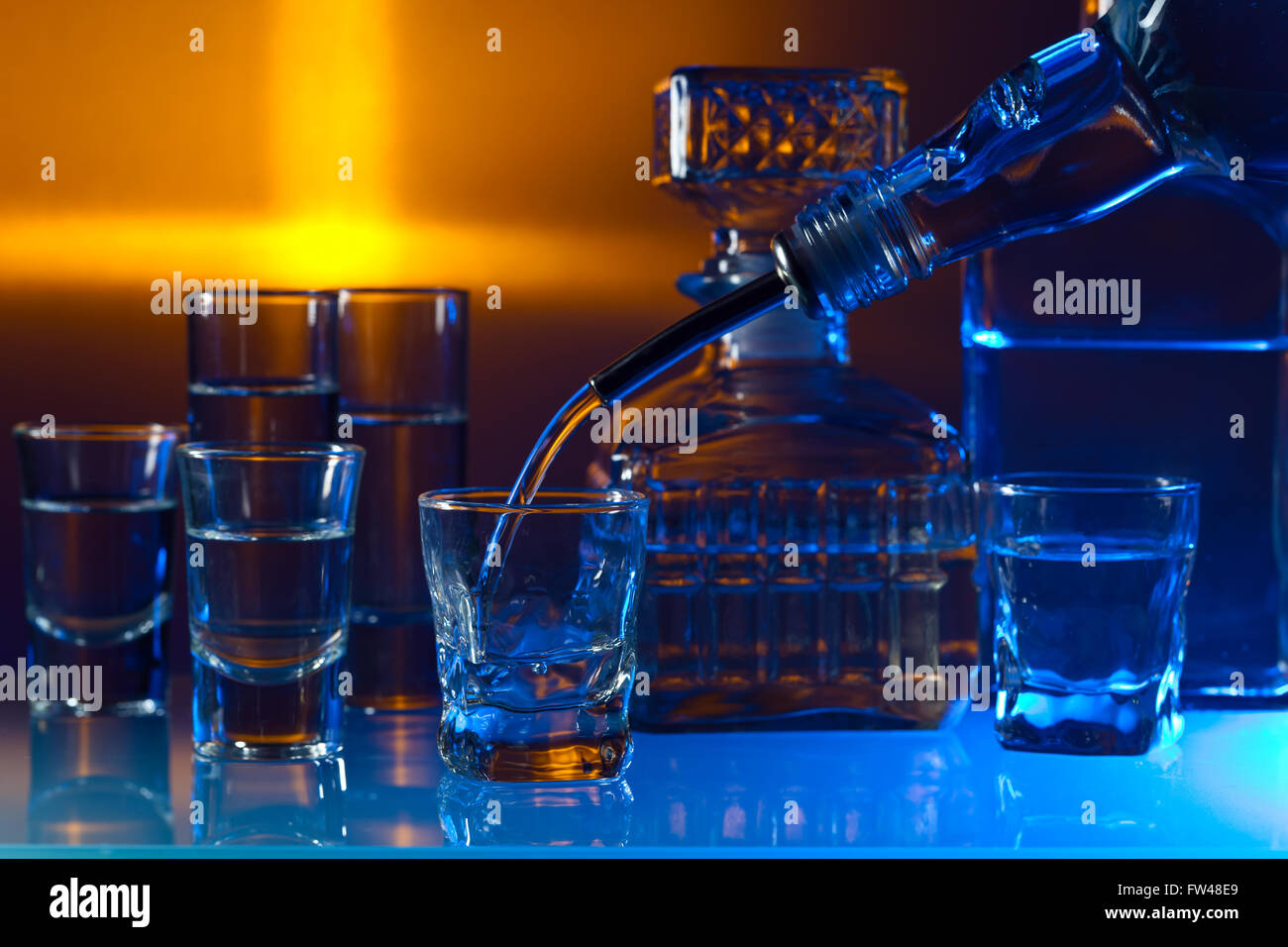 vodka in bar on a glass table Stock Photo - Alamy