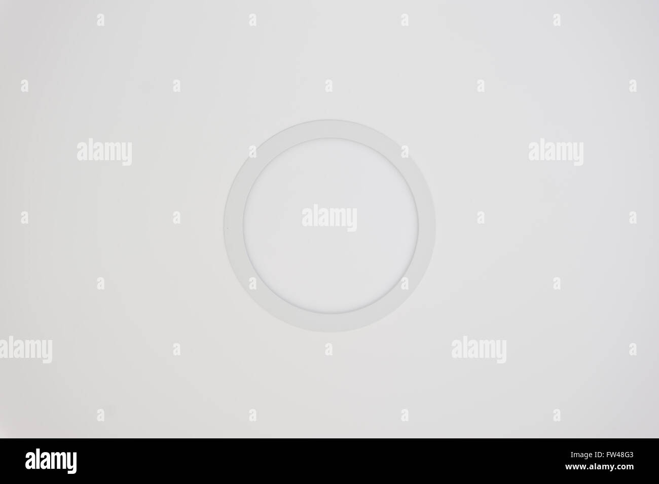 White round LED lamp at ceiling. Circle centered Stock Photo - Alamy