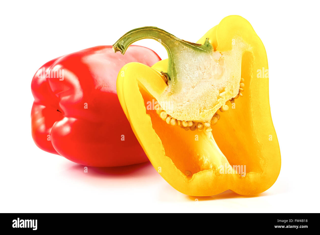 Red and half of yellow bell peppers on a white background Stock Photo ...