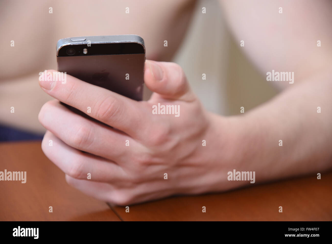 Teenage Boy Using An Apple 5s iPhone Mobile Phone Stock Photo - Alamy