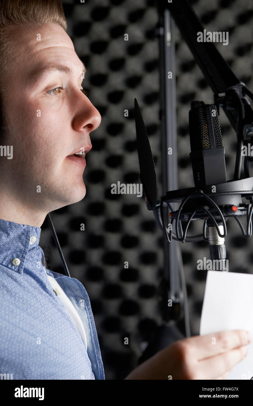 Man In Recording Studio Talking Into Microphone Stock Photo - Alamy