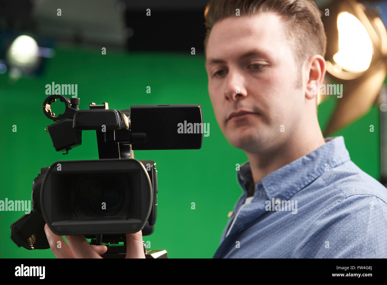 Male Camera Operator In Television Studio Stock Photo - Alamy