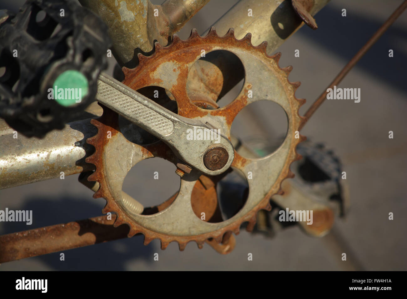 A picture of a rusted gear on a bicycle. This is a common site in China ...