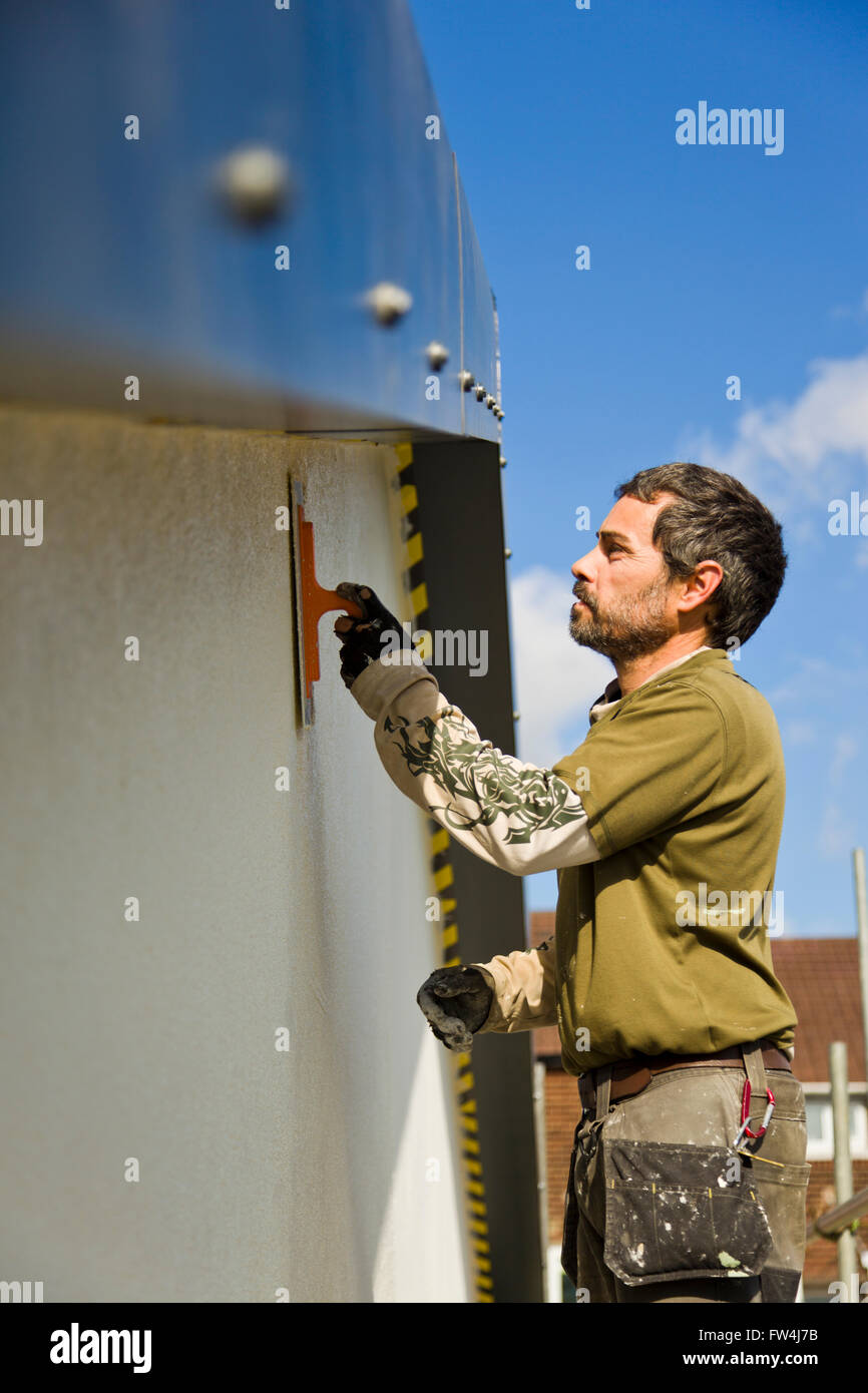 Builder rendering the gable end of a house Stock Photo - Alamy
