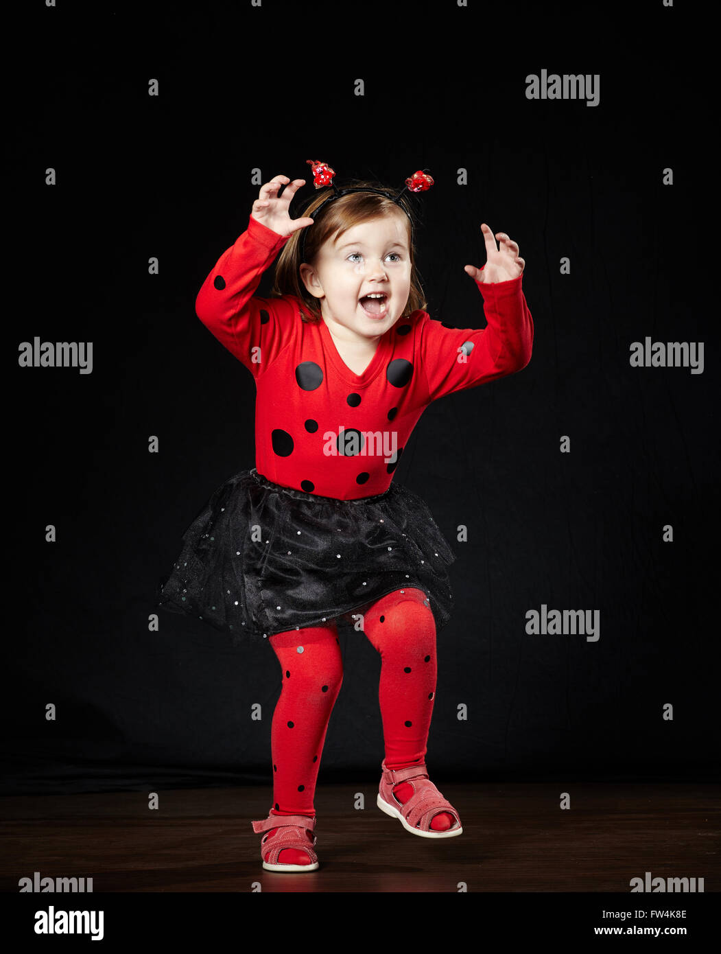 little funny girl in ladybug costume Stock Photo - Alamy