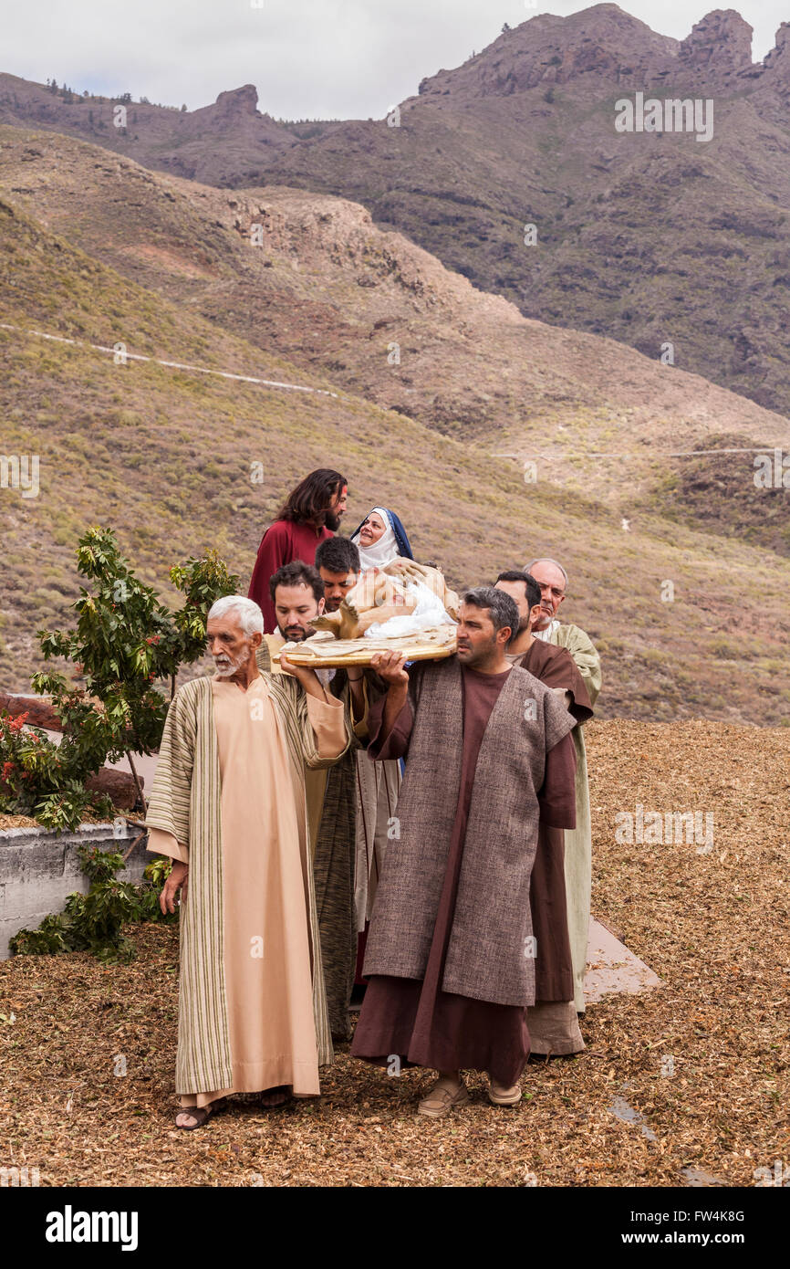 Actors from the Passion play carry a statue of the dead Jesus from the ...