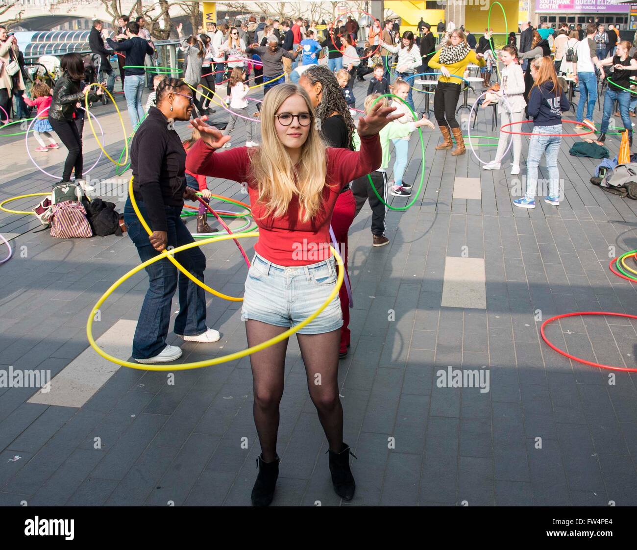 Hula hoop lesson mass group fun girl woman Stock Photo - Alamy