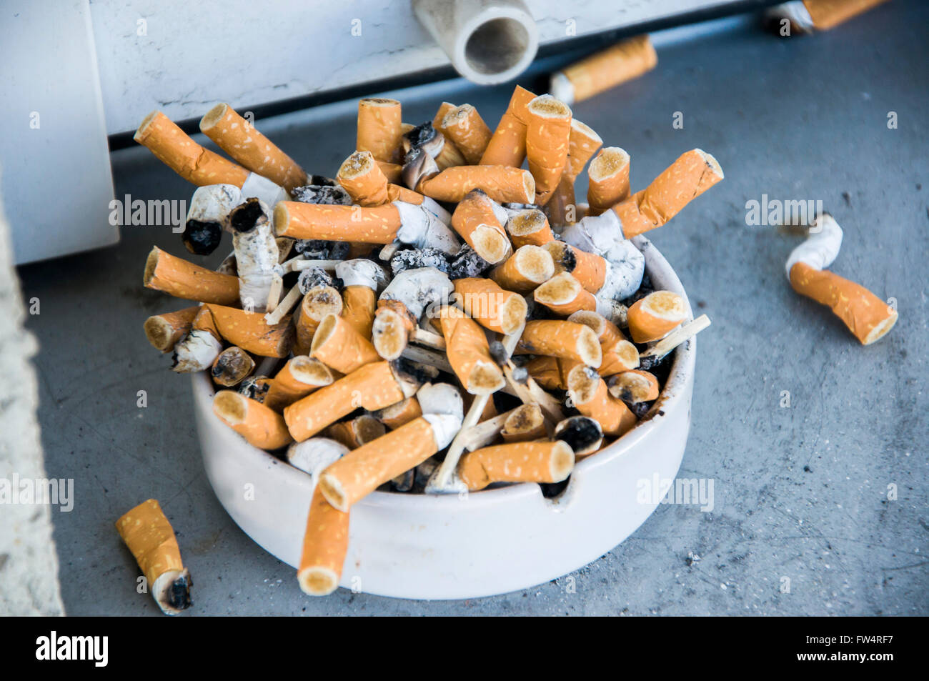 Bad addiction. Ashtray and cigarettes close-up Stock Photo - Alamy