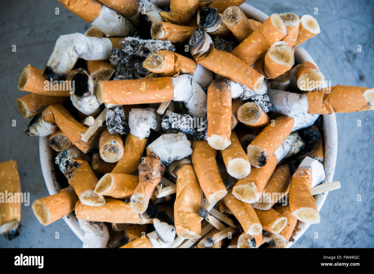 Bad addiction. Ashtray and cigarettes close-up Stock Photo - Alamy