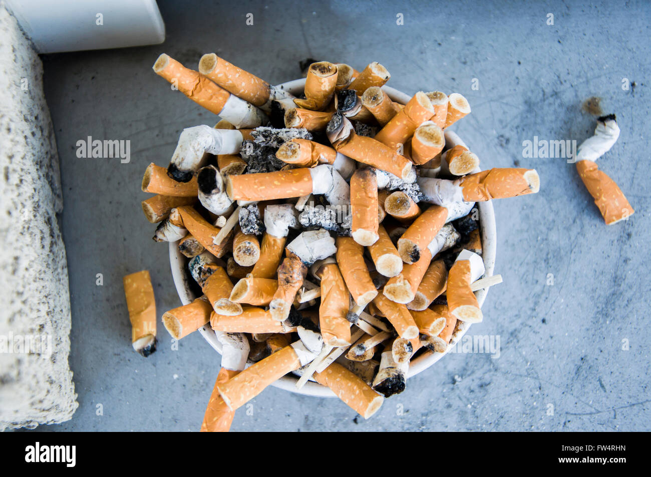 Bad addiction. Ashtray and cigarettes close-up Stock Photo - Alamy