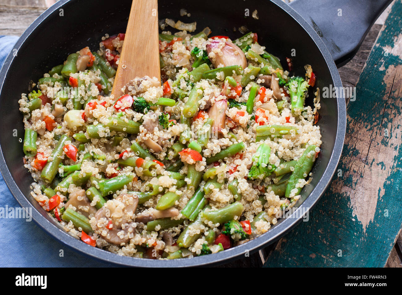 quinoa and vegetables on rustic pan with wood spoon Stock Photo - Alamy
