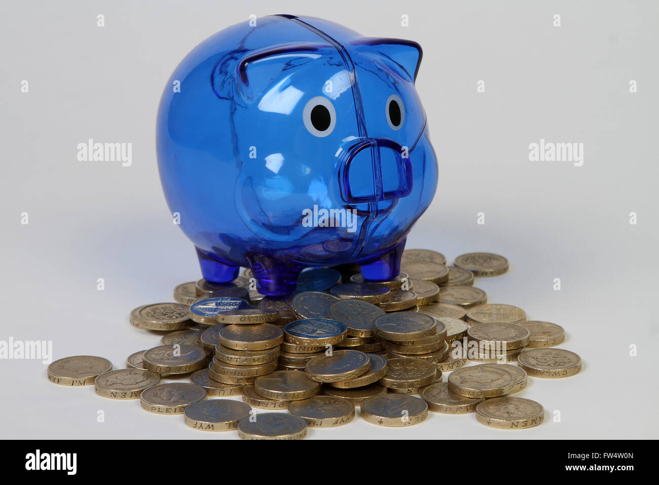 Money being saved in piggy bank Stock Photo - Alamy