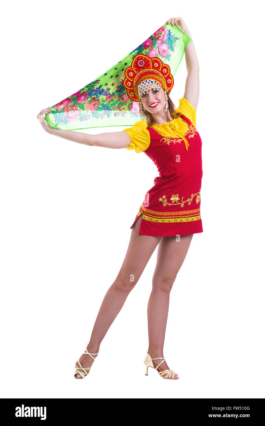 Young woman wearing a folk costumes dancing. Isolated on white in full ...