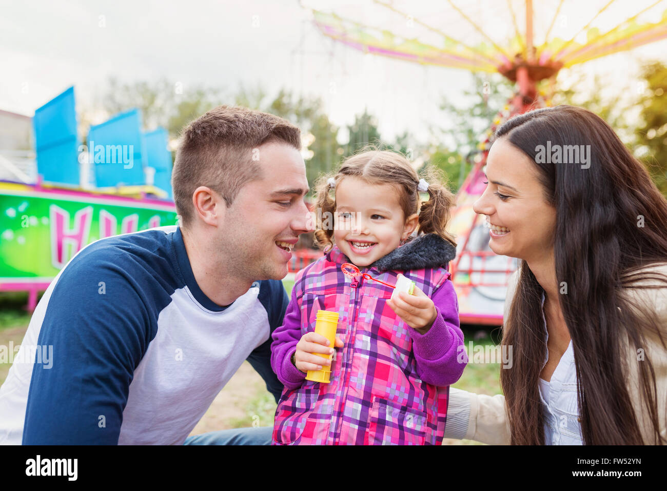 Mother and daughter at fun fair, chain swing ride Stock Photo - Alamy