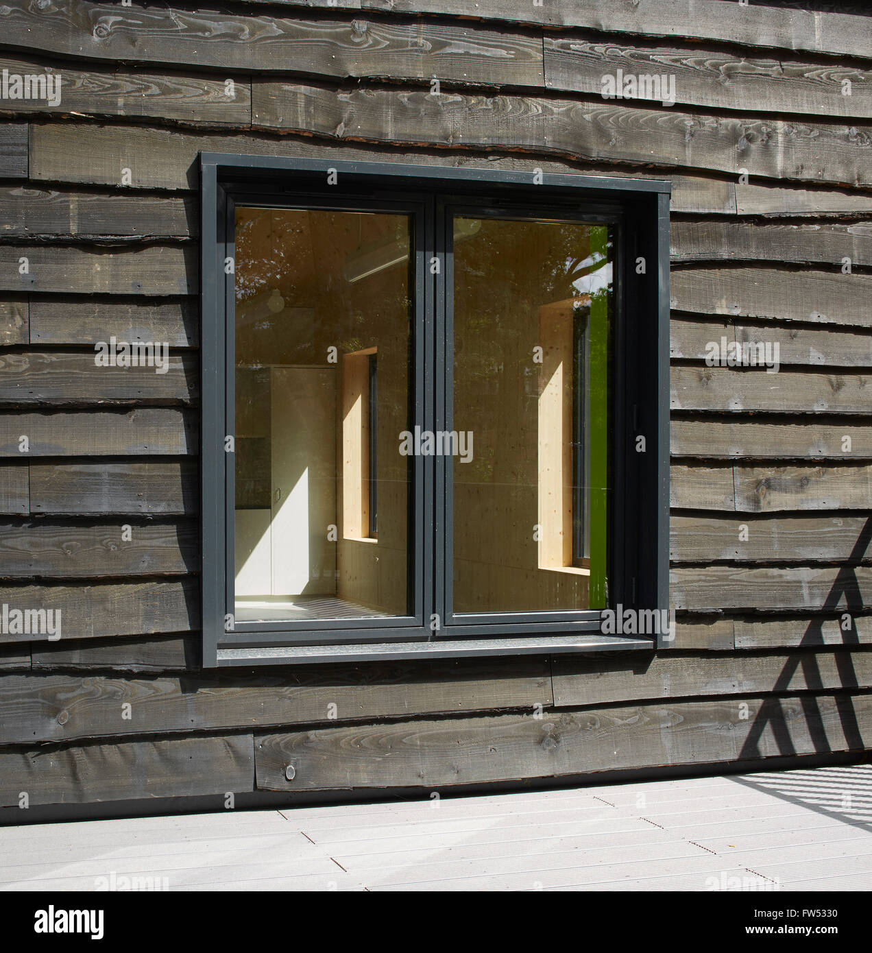 Timber clad facade with window view through. Davenies School ...