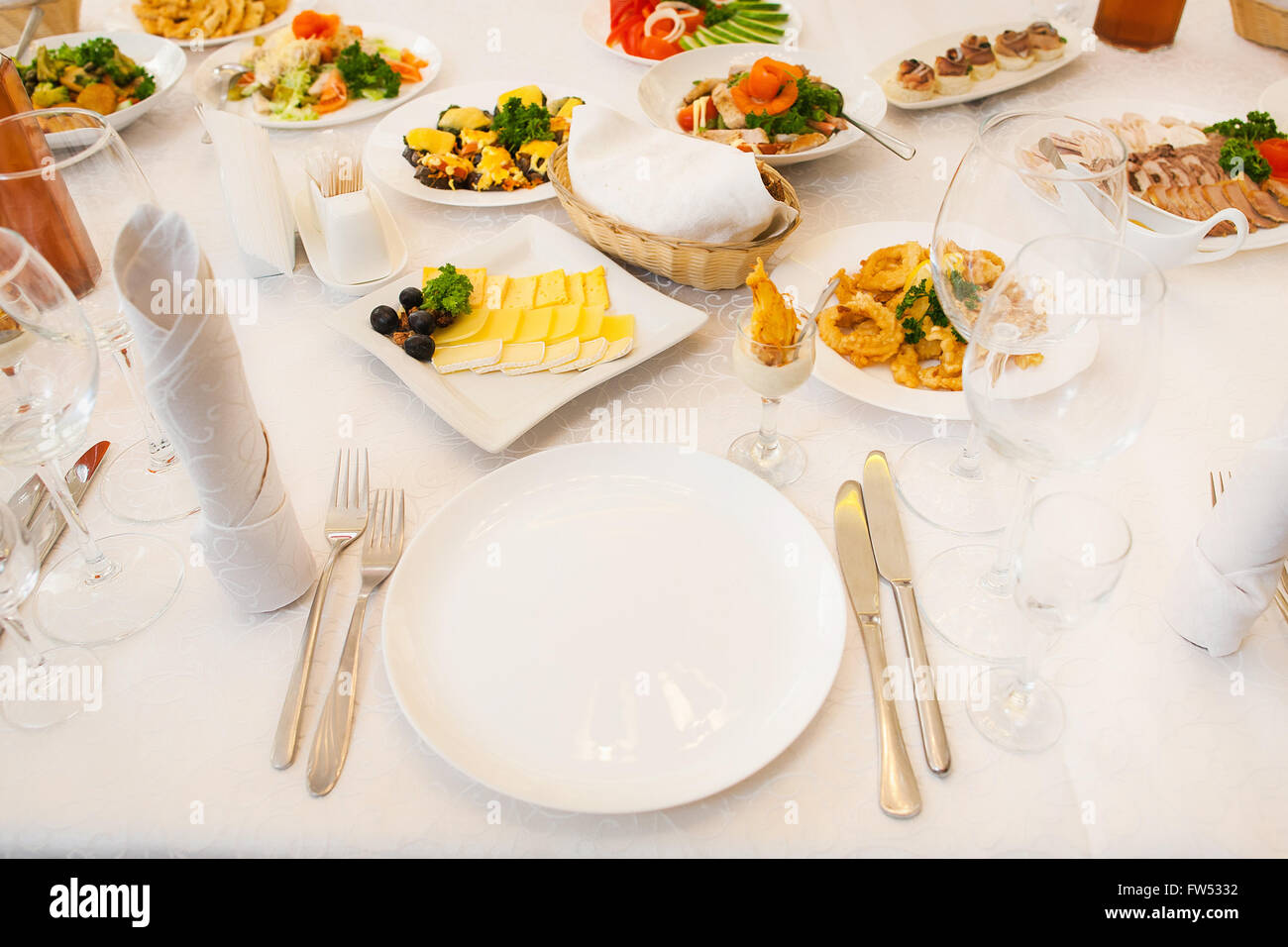 Table served with different food and flatware. Beautiful table ready ...