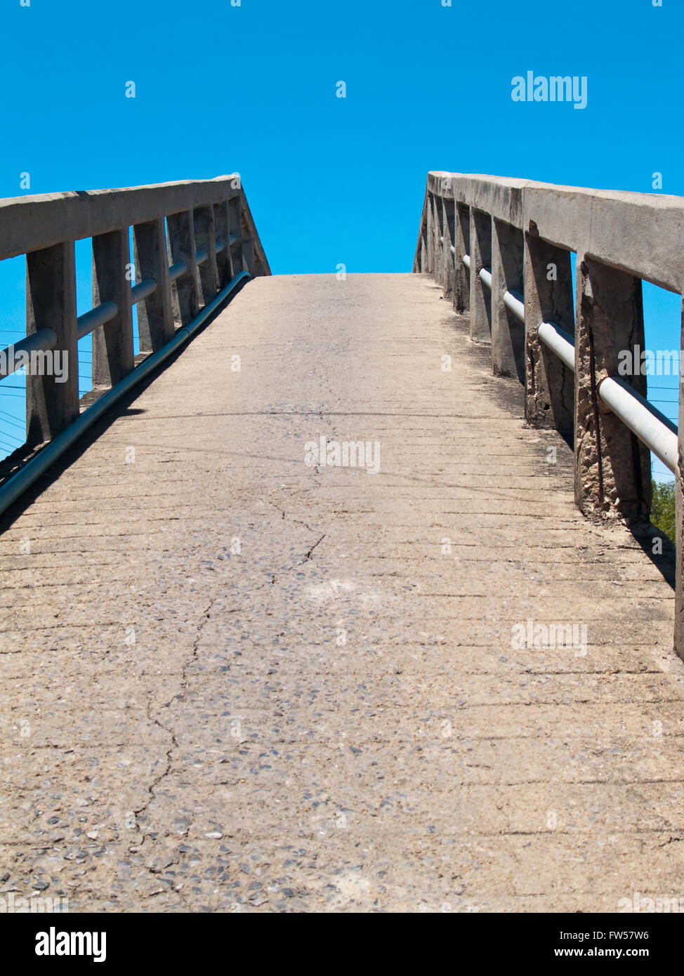 Small concrete bridge and bright blue sky Stock Photo - Alamy