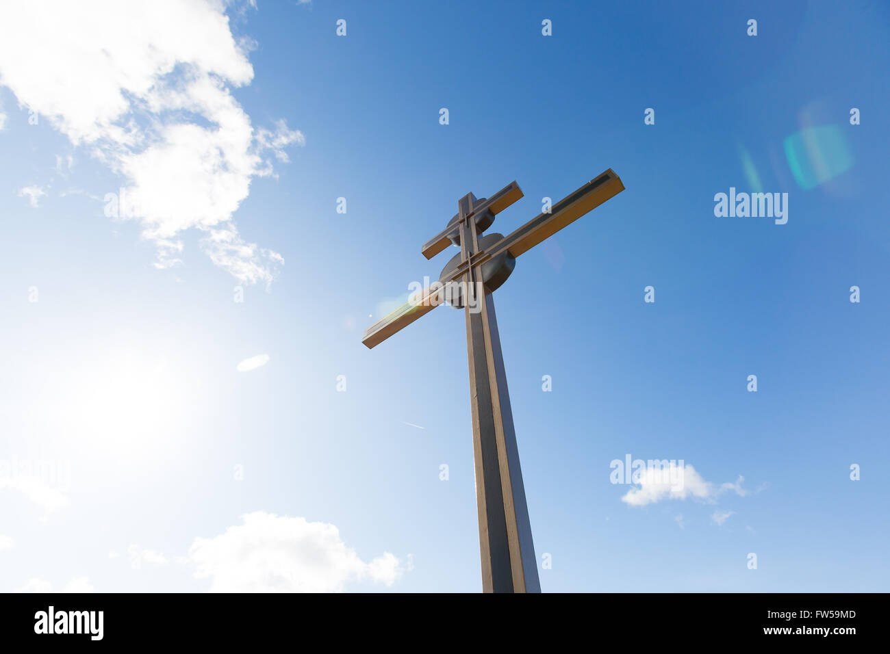 Cross and sunny sky background Stock Photo - Alamy