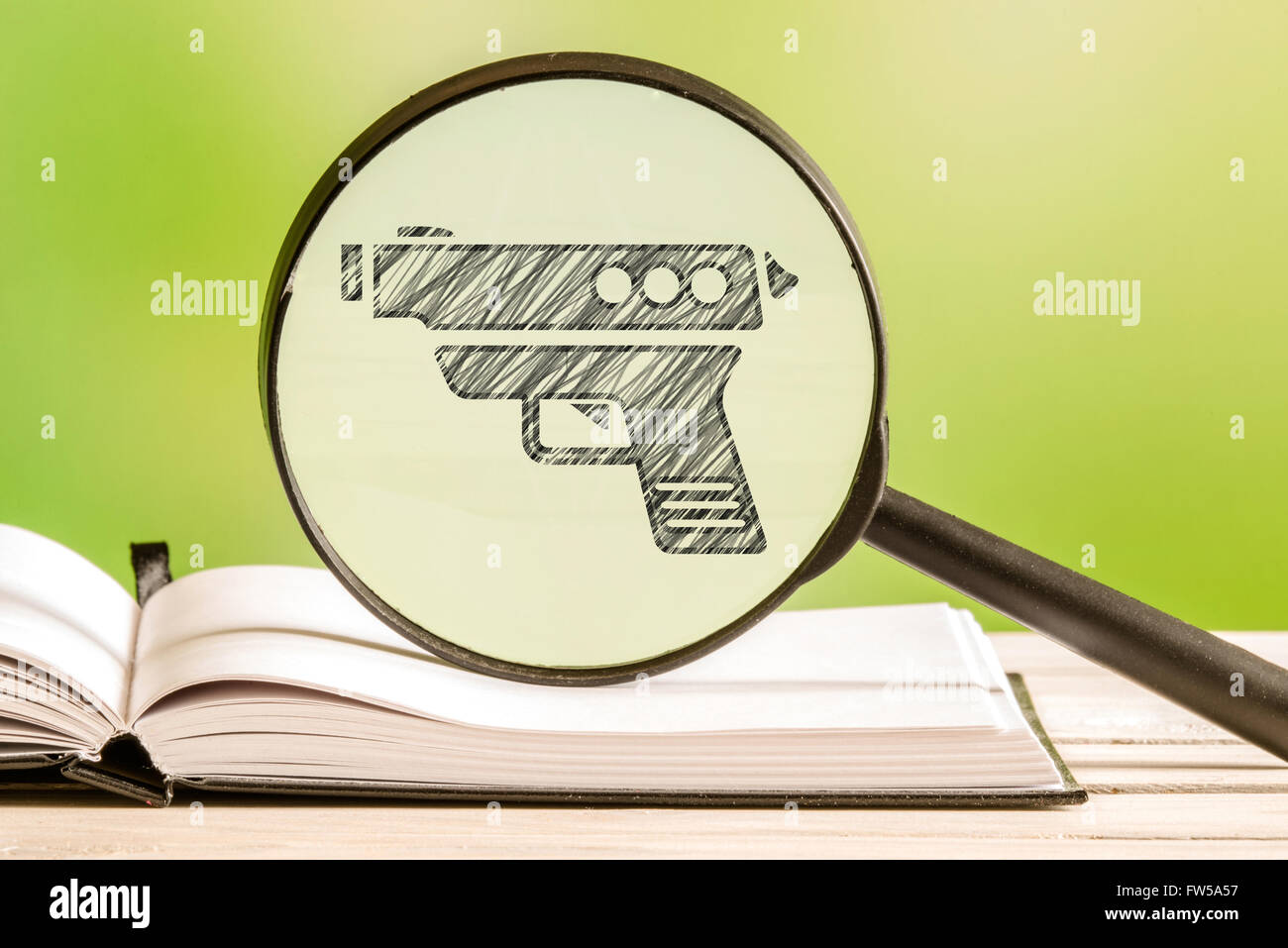 Weapon information with a pencil drawing of a gun in a magnifying glass ...