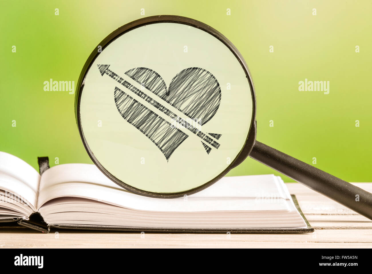 Love search with a pencil drawing of a heart with an arrow in a ...